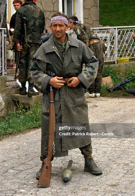 A Muslim Bosnian Soldier Stands With His Weapons On The Eastern News