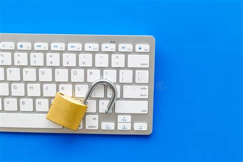 computer system protection from hacker with locker and keyboard on blue