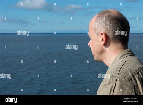 Sea Sickness Patch Man Wearing A Scopoderm Patch Behind His Ear This