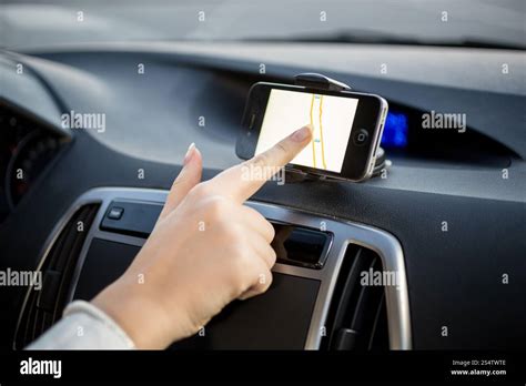 Female Driver Using Touchscreen Smartphone With Gps Navigation Stock