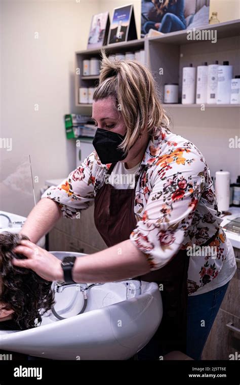 Beautiful Young Woman Enjoying A Head Massage With Her Eyes Closed
