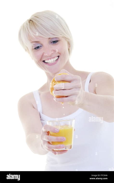 woman squeeze fresh orange juice drink isolated over white background Stock Photo - Alamy