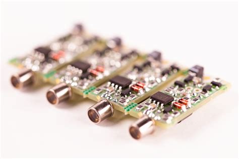 Premium Photo Closeup Of Four Small Microcircuits Pcb With The Output