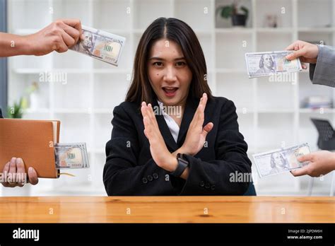 Asian Woman Refusing Money In The Envelope To Agreement Contract Bribe
