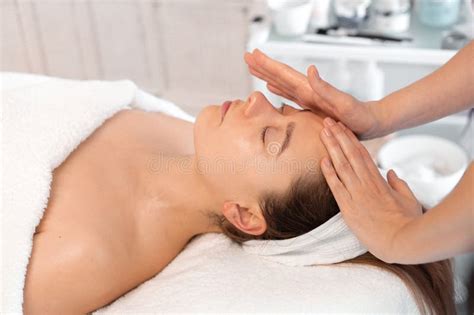 Crop Therapist Massaging Womanand X27s Forehead At Cosmetology Clinic