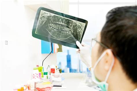 Premium Photo Doctor Analyzing X Ray In Hospital