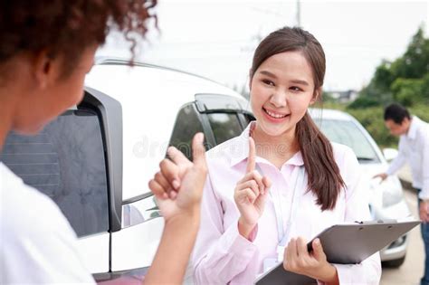 Car Insurance Agent Holding A Car Accident Claim Process Document Form