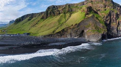 Aerial View Of Black Sand Beach And Rocky Cliff In Iceland Stock Image