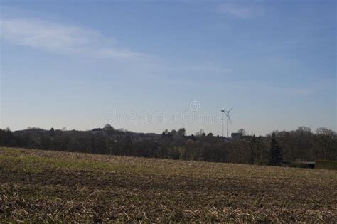 A Field With Trees And Wind Turbines Stock Image Image Of Farmland Climate