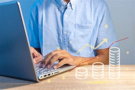 A Man Using A Laptop With Virtual Screen Of Business Finance Data Analytics Graph Chart Report