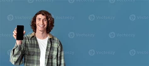 Happy Caucasian Teenager Showing Mobile Phone With Blank Screen On
