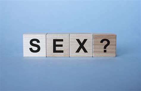 Three Wooden Cubes With Word SEX On Table With Question Mark Evolutionary Men