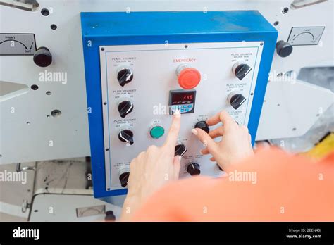 Woman Pressing Start Button On Label Printing Machine Stock Photo Alamy
