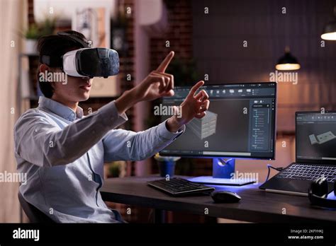 Asian Man Developing Industrial Product With Computer Interface And Vr