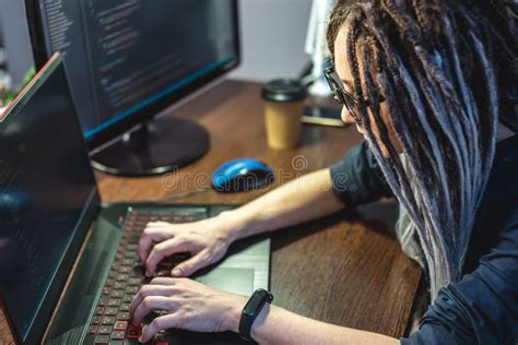 Modern Young Female Programmer Is Writing Program Code On A Laptop At