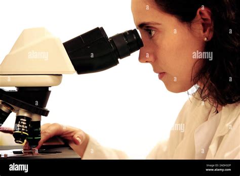 Light Microscopy Female Researcher Using A Light Microscope Stock Photo Alamy