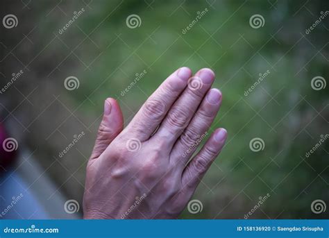 The Hand That Is Bent And Upside Down Makes It Visible Only On The Back