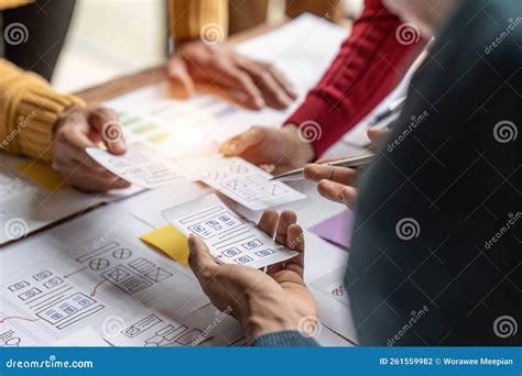 Group Of Ux Developer And Ui Designer Brainstorming About App Interface Design At Modern Office