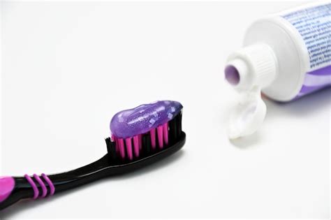 Premium Photo Whitening Purple Toothpaste On A Toothbrush Closeup