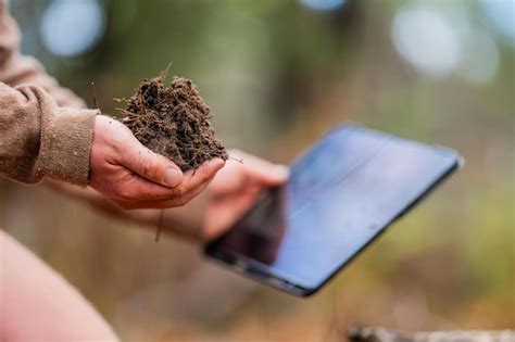 Premium Photo University Babe Conducting Research On Forest Health Farmer Collecting Soil