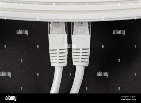 Connect An Ethernet Cable To A Wireless Router On Dark Ethernet Rj45 And Electric Cables