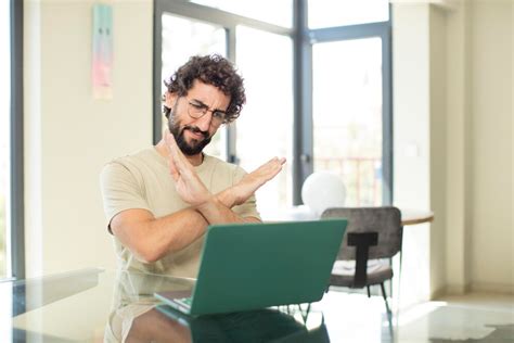 Premium Photo Cool Bearded Man Working At Home In A Laptop