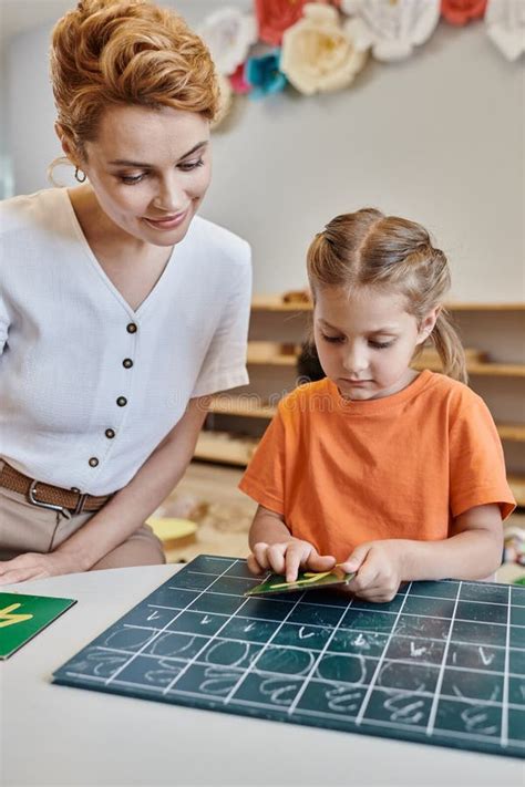 smart girl pointing at number near stock image image of interaction
