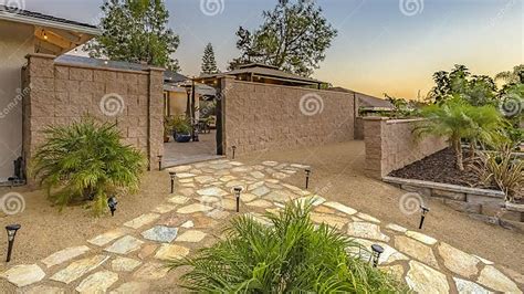 Panorama Frame Stone Pathway Lined With Bollard Lights Outside The