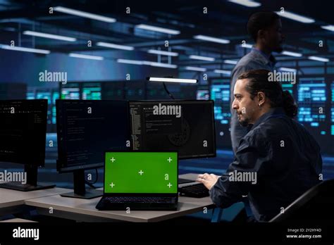 Admin In Data Center Using Isolated Screen Laptop To Check For Server