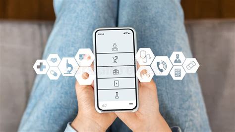 woman at home using medical app on smartphone to access healthcare