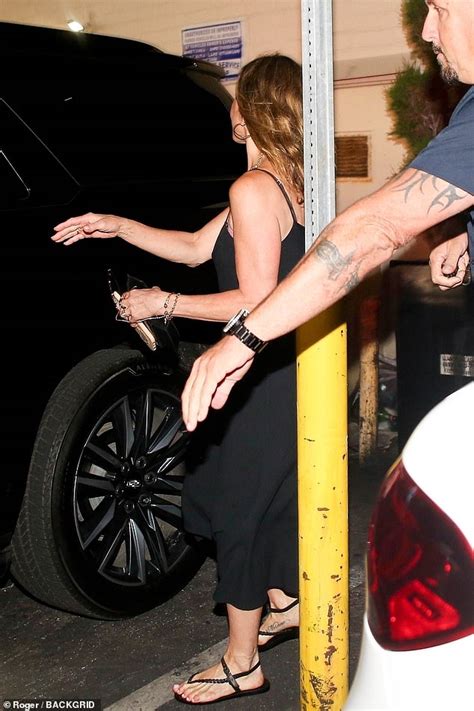 EXCLUSIVE Jennifer Aniston Revisits The Nineties In Slip Dress And Gives A Flash Of Her