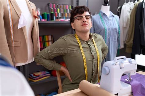 Non Binary Man Tailor Stressed Using Sewing Machine At Atelier Stock Image Image Of Person