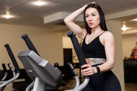 Attractive Sexy Woman On The Simulator Premium Photo