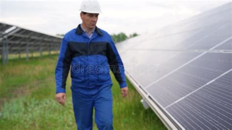 Service Engineer Or Electrician Goes By Solar Panels Working And