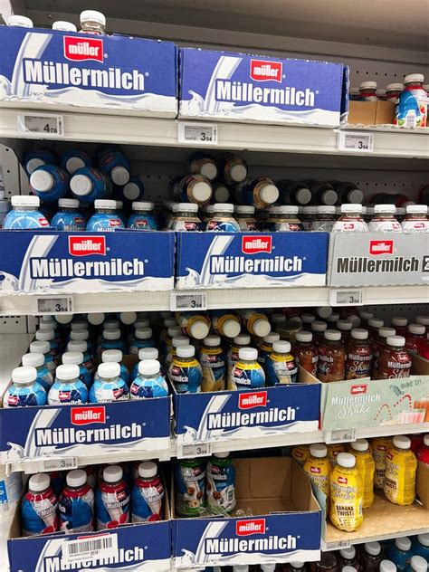 Shelves Stocked With Various MÜller Flavored Bottled Dairy Drinks In A
