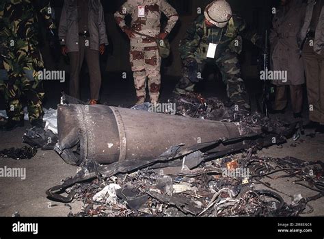 Explosive Ordnance Disposal Technicians Inspect The Remains Of An Iraqi