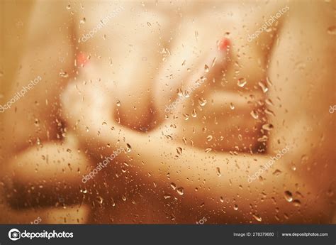 Blurred View On Sexy Girl In Shower Behind Wet Glass Stock Photo Superelaks