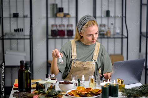 Fragrance A On Table With Many Bottles Of Essential Oil Is Testing Scent By A Perfumer Before