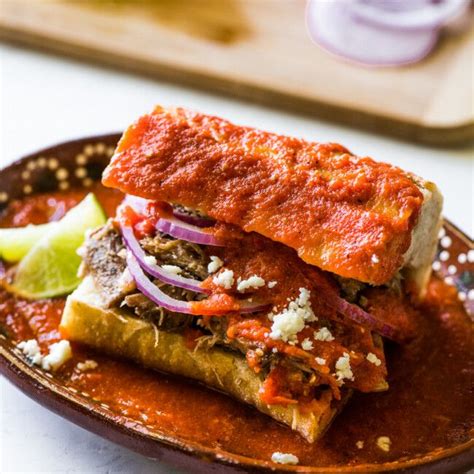 A Delicious Torta Ahogada Filled With Mouthwatering Carnitas And