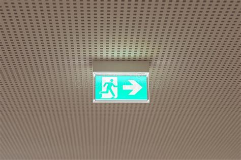 Glowing Exit Sign On The Ceiling In The Corridor Stock Image Image Of Door Safe