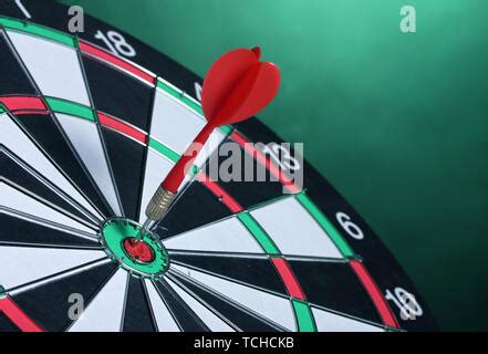 Dart Board On Green Background Stock Photo Alamy
