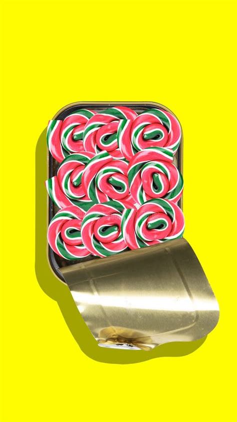 Can Filled With Candy Canes Against Bright Yellow Background Contemporary Art Collage Stock