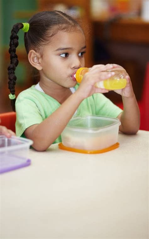 Drink Juice And Girl In Kindergarten With Food For Nutrition At School
