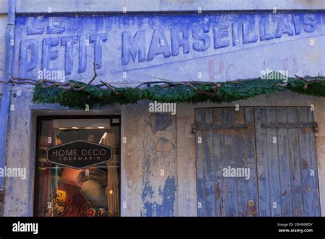 Old Sign For Le Petit Marseillais A Famous Proven Al Body Wash Brand On The Front Of A Shop In