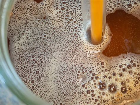 Close Up Of Craft Beer And Foam In A Fermentation Container Stock Image