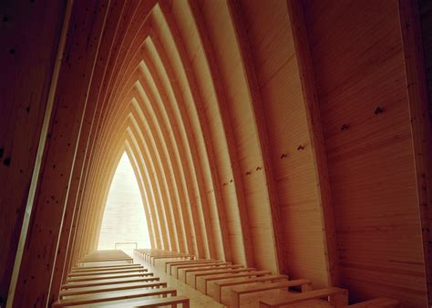 Copper Clad Chapel In Finland Has A Curving Wooden Frame