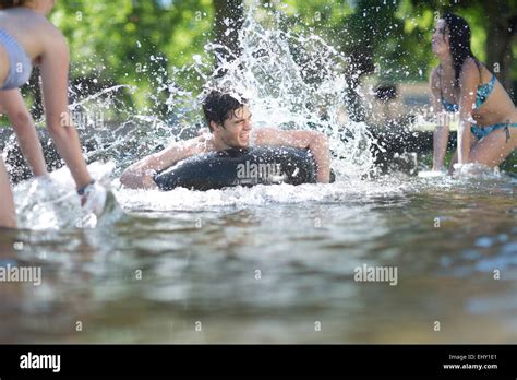 Man Floating In An Inner Tube Hi Res Stock Photography And Images Alamy