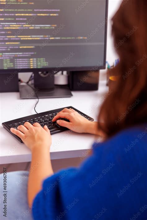 Female Software Developer Coding While Working In Home Office Stock Photo Adobe Stock