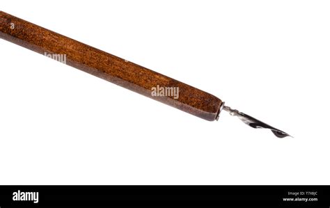 Side View Of Steel Nib Filled By Black Ink In Brown Dip Pen Close Up Isolated On White