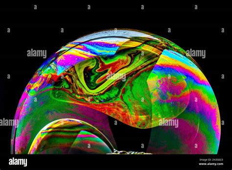Extreme Close Up Detail Of A Very Colourful Iridescent Soap Bubble